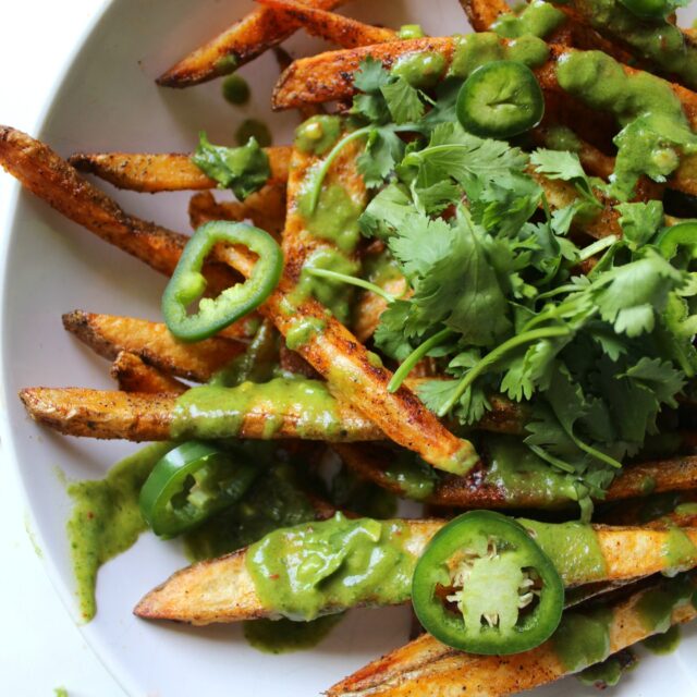 Loaded Baked Fries with Cilantro Lime Dressing - This Savory Vegan