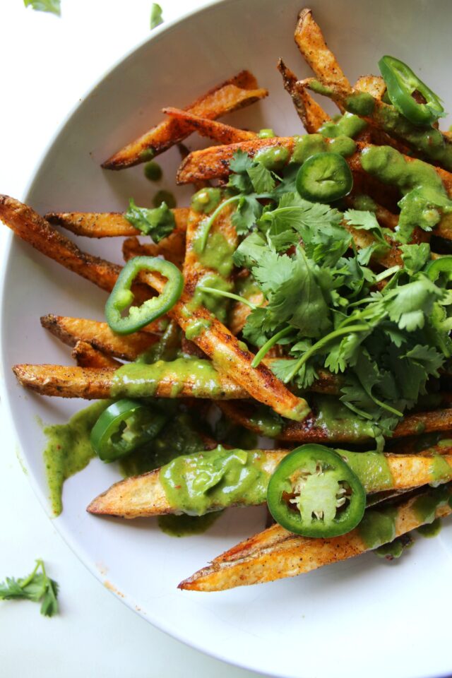 Loaded Baked Fries with Cilantro Lime Dressing - This Savory Vegan